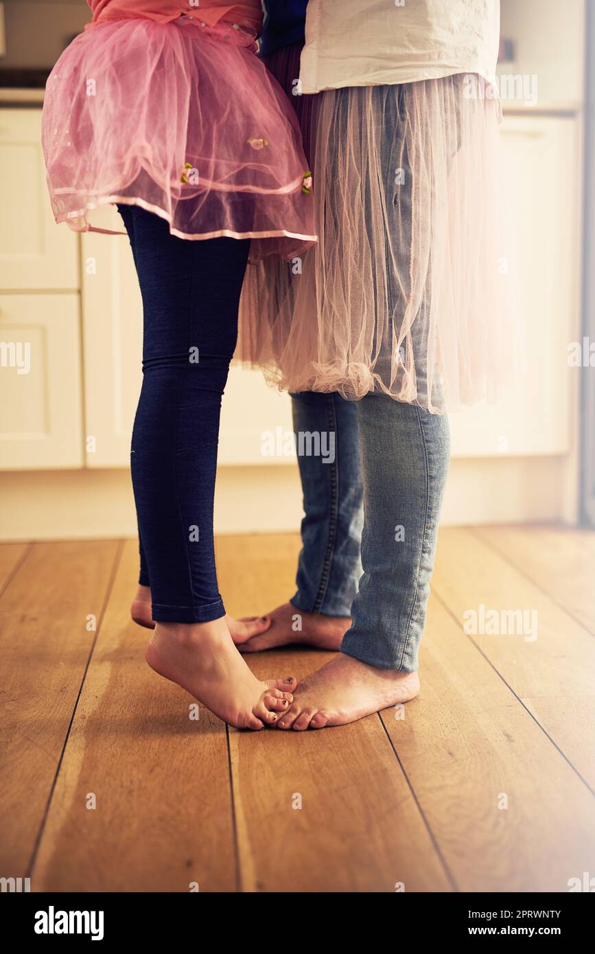 Girl dancing on father's feet hi-res stock photography and images - Alamy