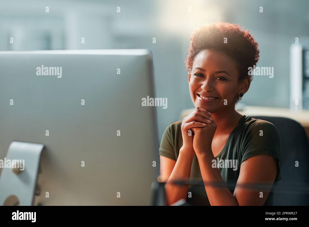 The face of job satisfaction. Portrait of a happy businesswoman sitting ...