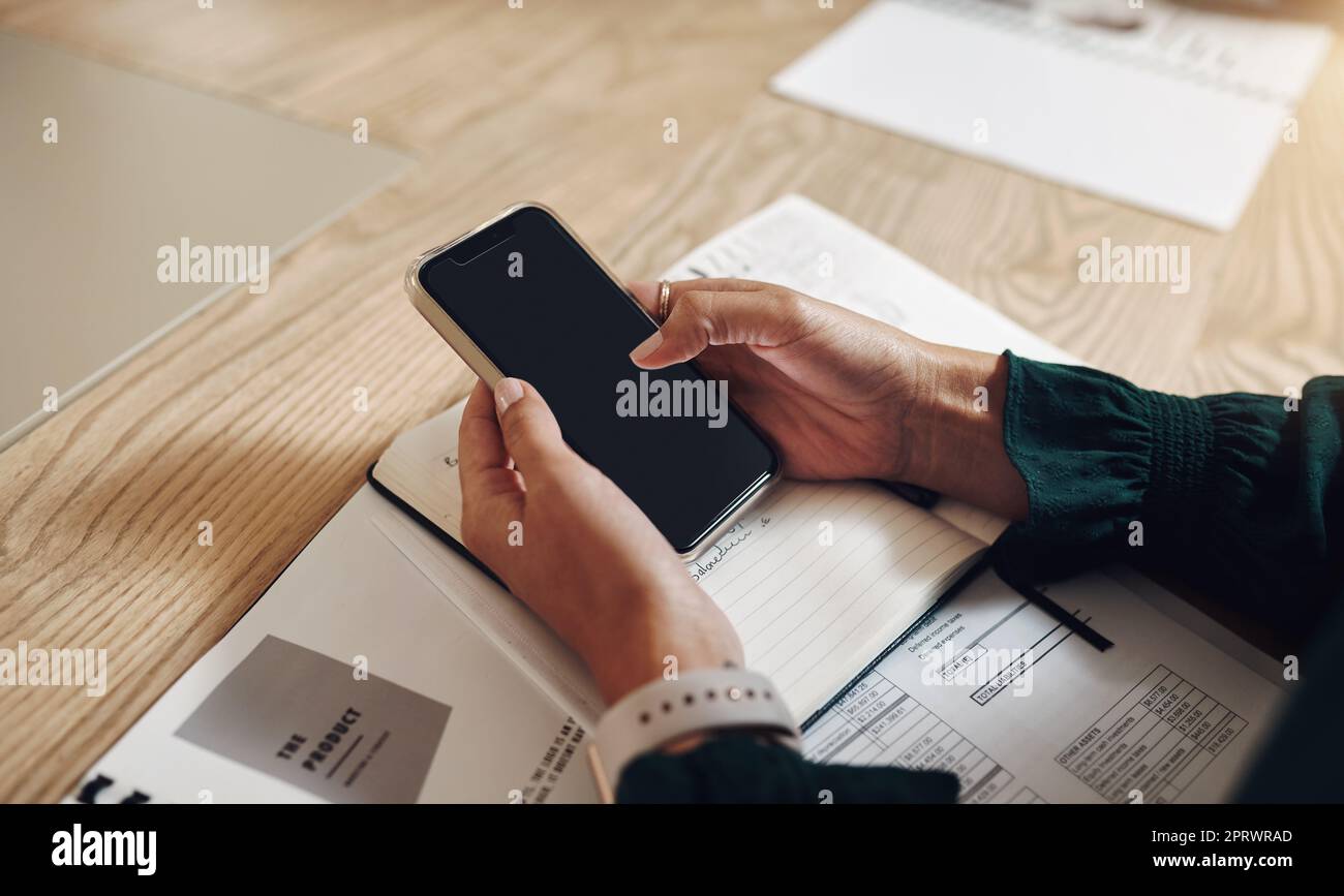 Preparing for the meeting. an unrecognizable businesswoman using her ...
