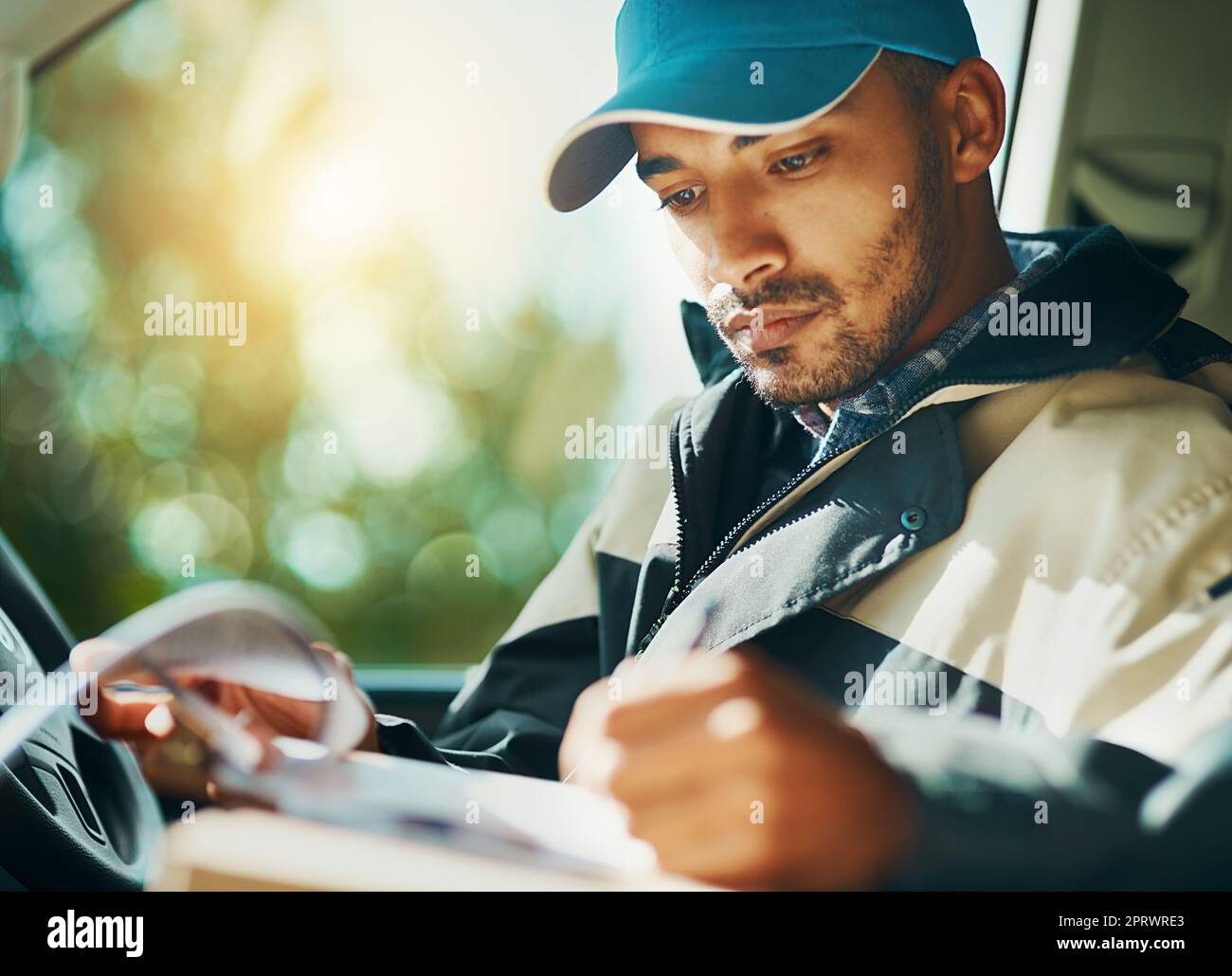 He plans where he needs to be. a courier making deliveries in his van ...