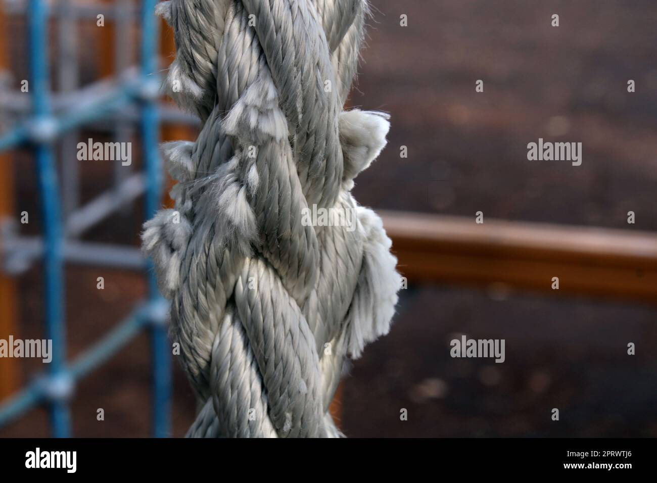 Worn gray rope close-up on a children's playground in a city park Stock ...