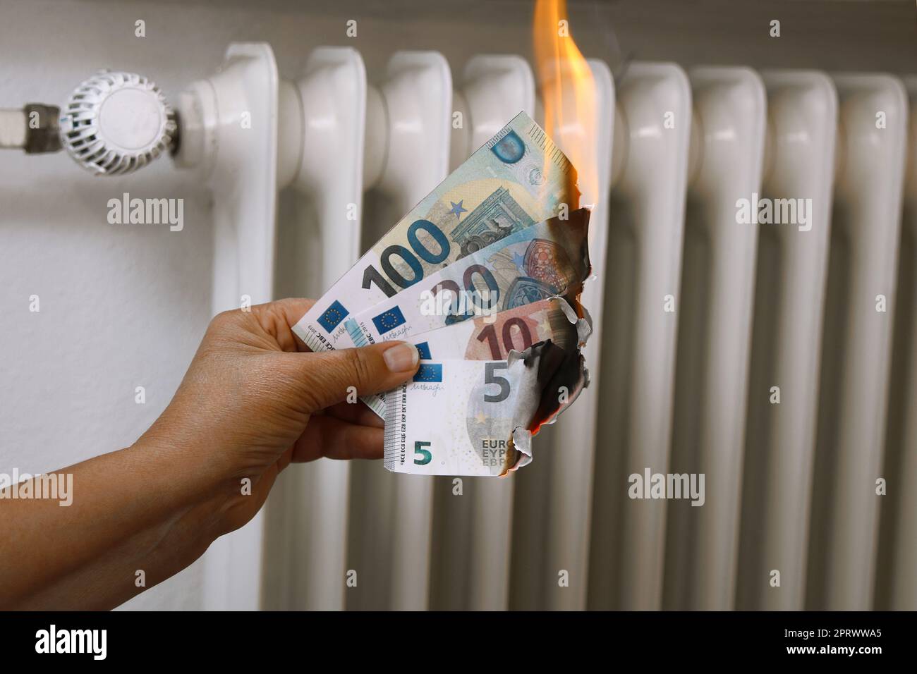 Money destruction through inflation Stock Photo - Alamy