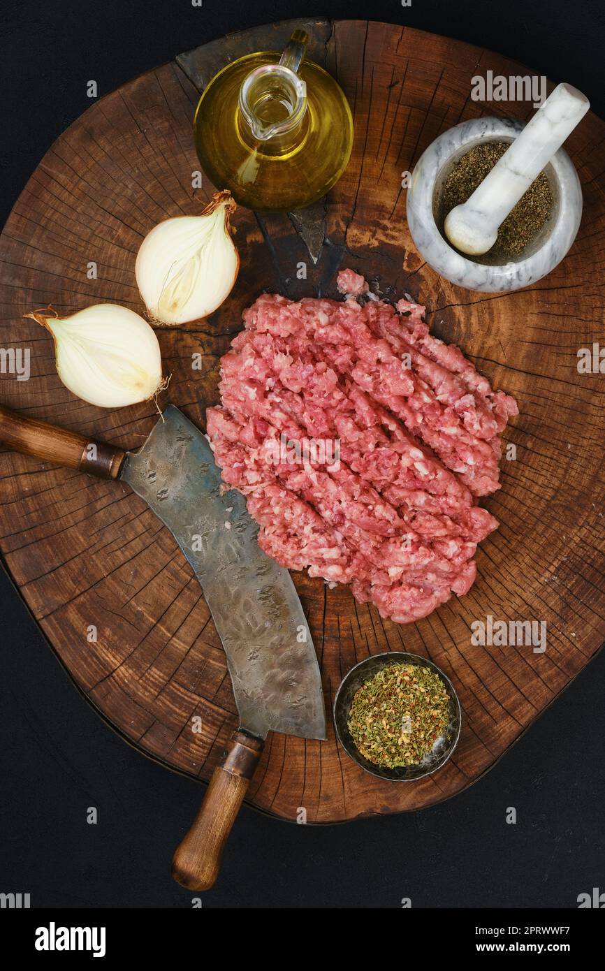 Making fresh mince meat with chopping knife, overhead view Stock Photo ...