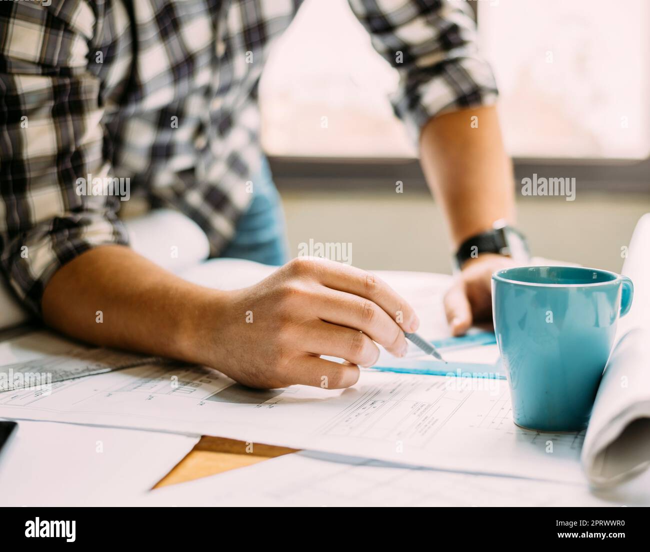 Architect drawing on his project Stock Photo - Alamy