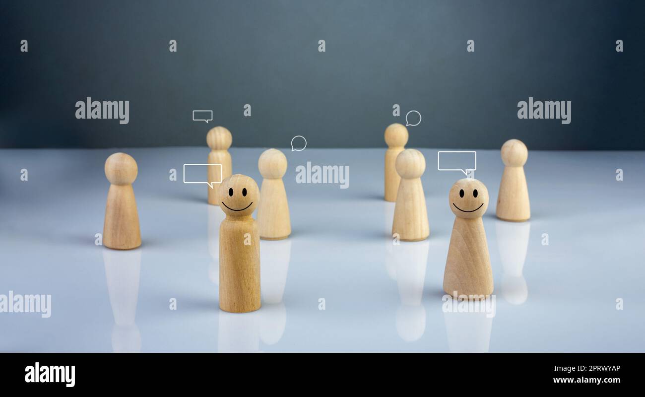 Wooden doll figure with communication and technology symbols. Social ...