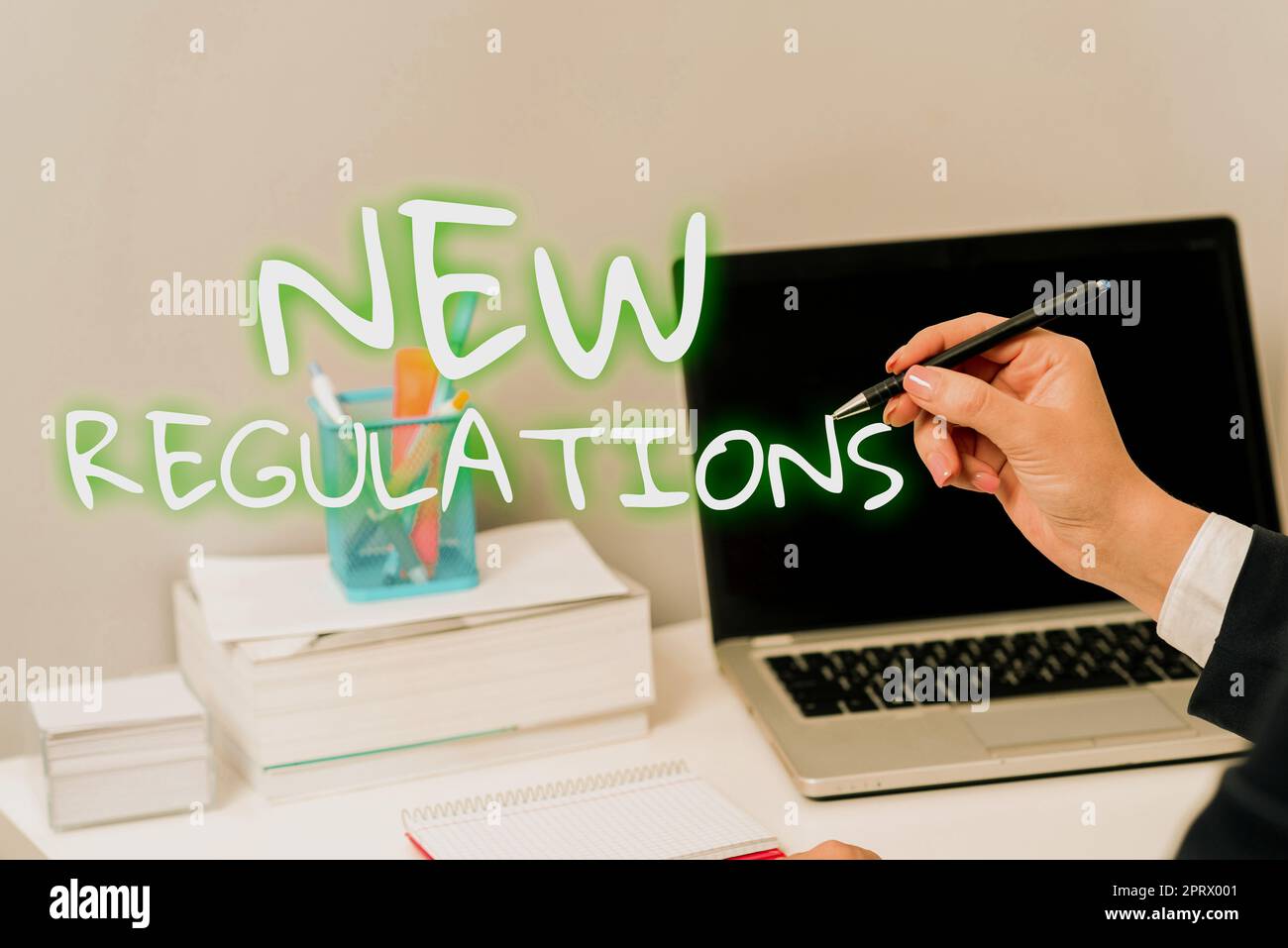 Hand writing sign New RegulationsRegulation controlling the activity ...
