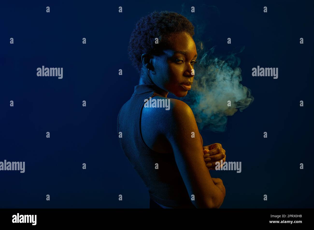 Passion woman blowing smoke curls Stock Photo - Alamy