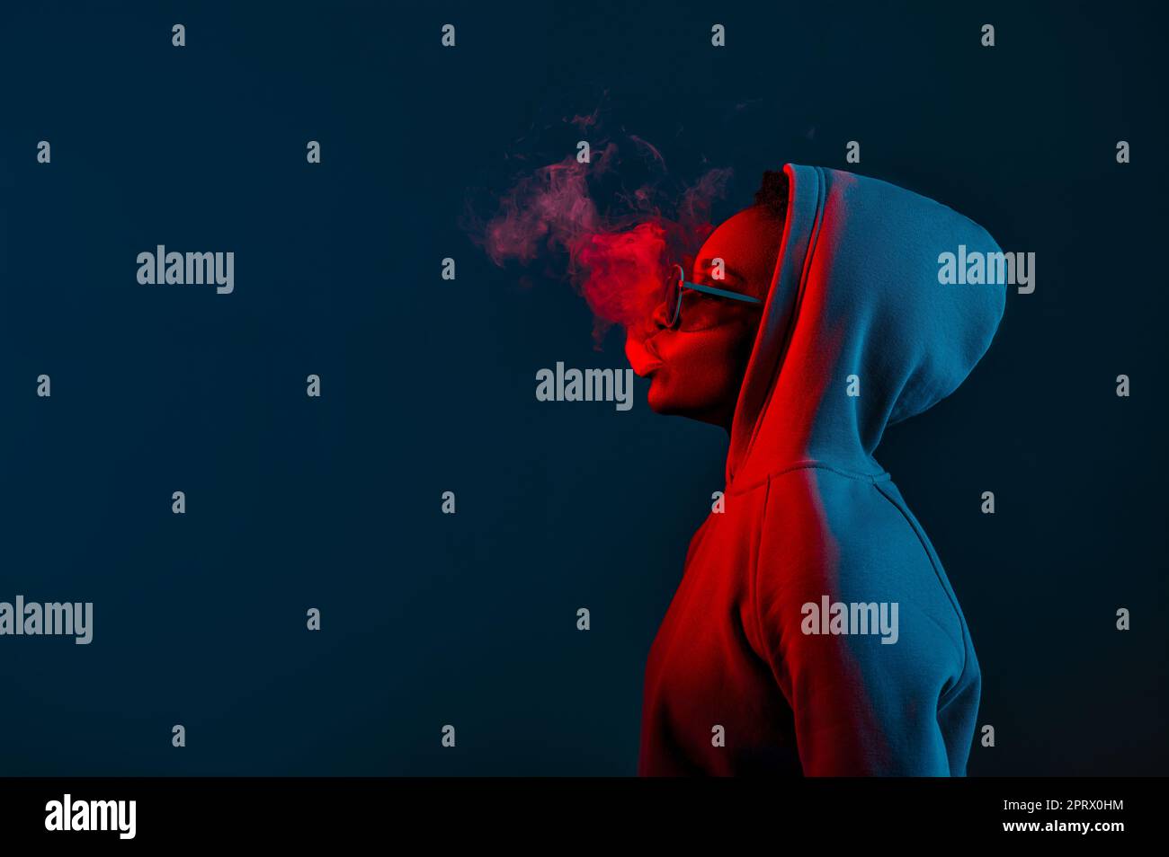 Casual hipster woman in hood blowing smoke Stock Photo - Alamy Casual hipster woman in hood blowing smoke Stock Photo - Alamy