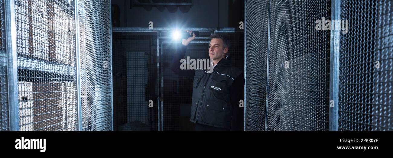 Security Guard Standing In The Warehouse Stock Photo - Alamy