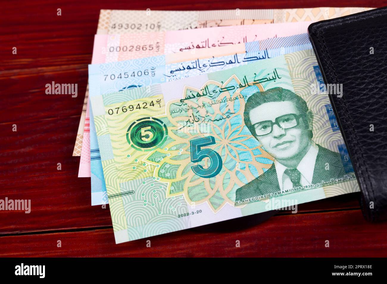 Tunisian money - new series of banknotes in the wallet Stock Photo - Alamy