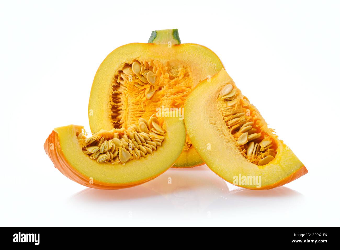 Pumpkin cut on half and on slices isolated on white Stock Photo - Alamy