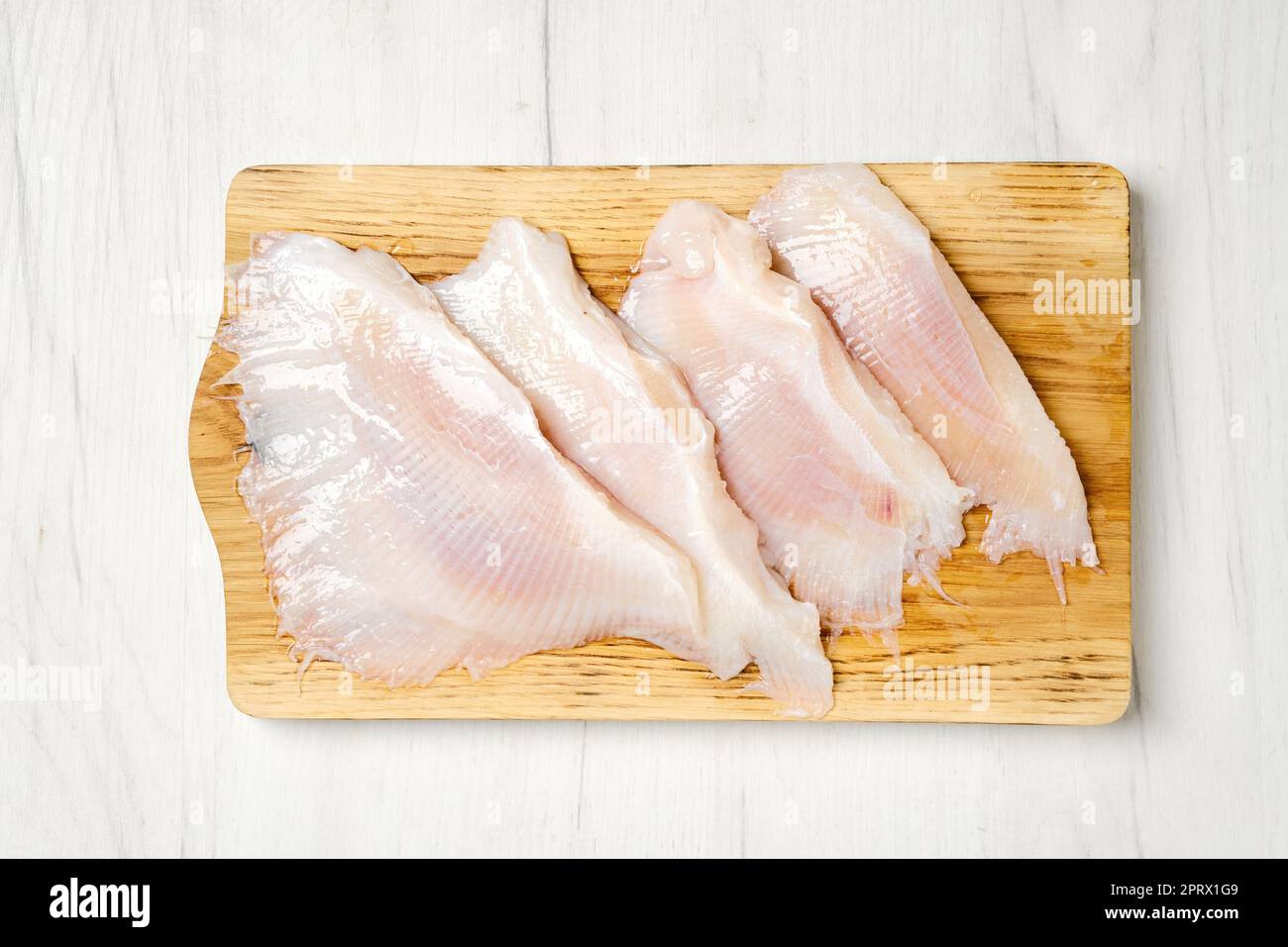 Overhead view of raw fresh stingray wings ready for frying Stock Photo ...