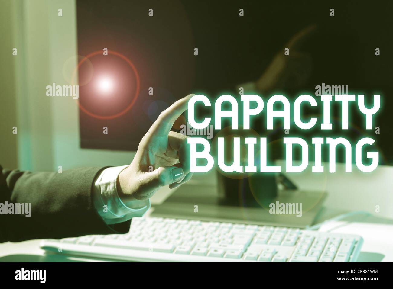 Text sign showing Capacity BuildingStrengthen the abilities of ...
