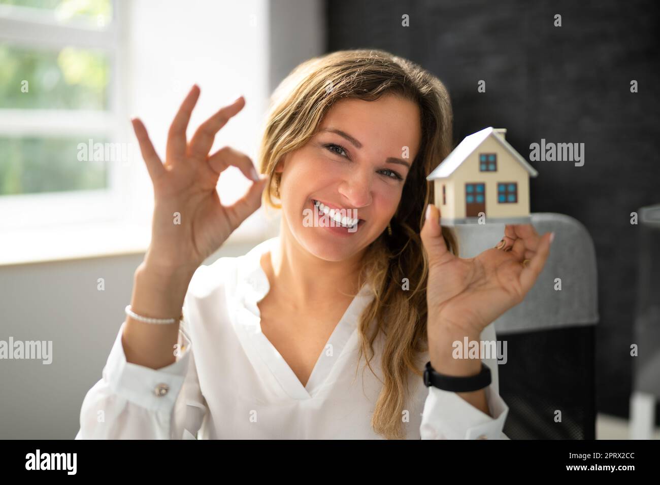 Happy Woman And House Construction Stock Photo - Alamy