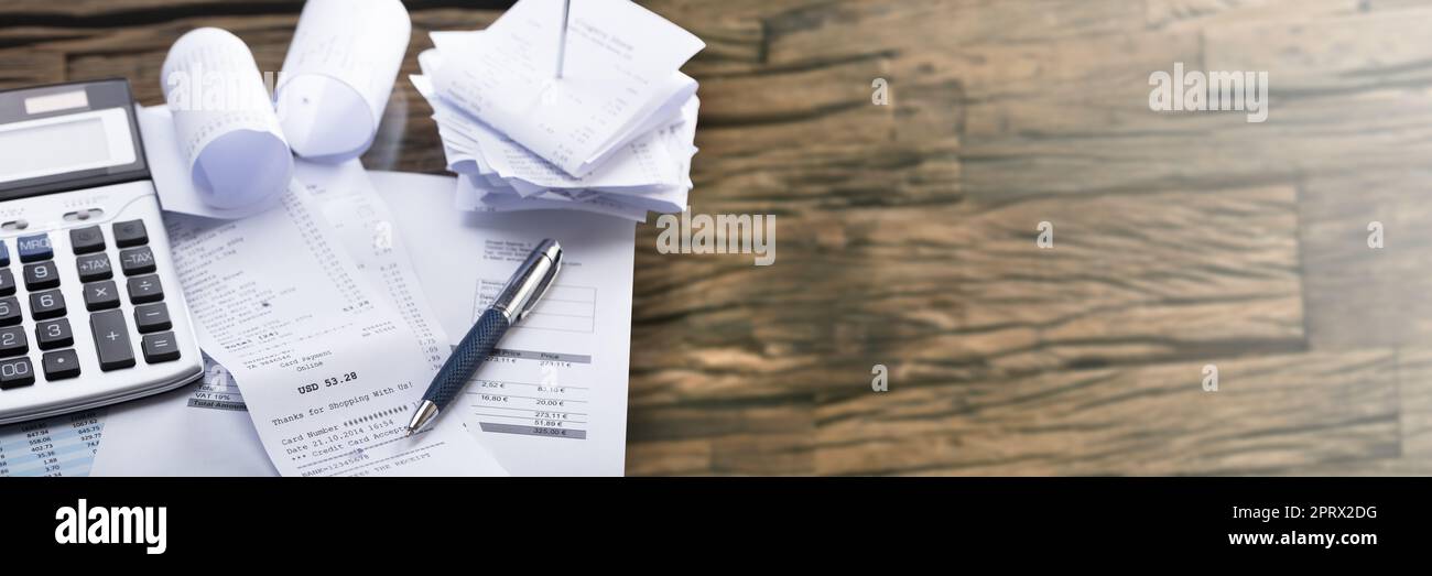 Calculator And Pen On Receipt Stock Photo - Alamy