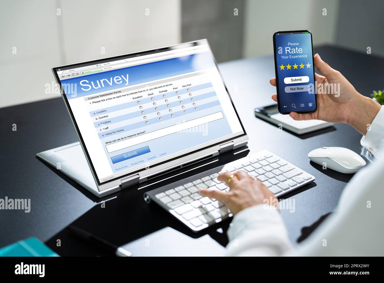 Businessperson Filling Online Survey Form Stock Photo - Alamy