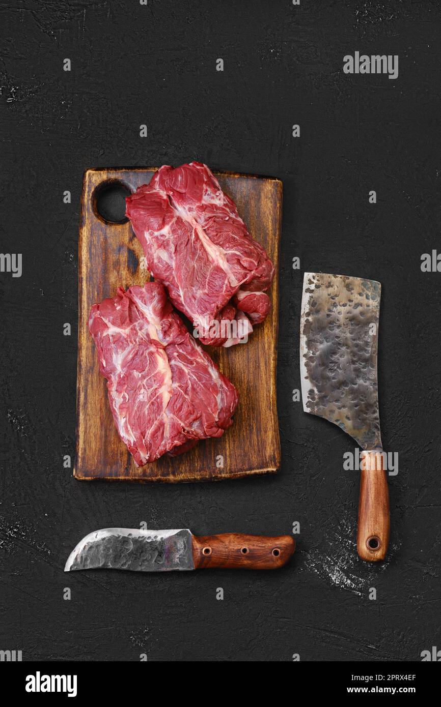 Top view of raw lamb boneless neck meat on cutting board Stock Photo ...