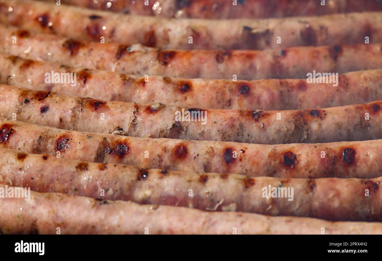 Smoking meat sausages on grill Stock Photo - Alamy