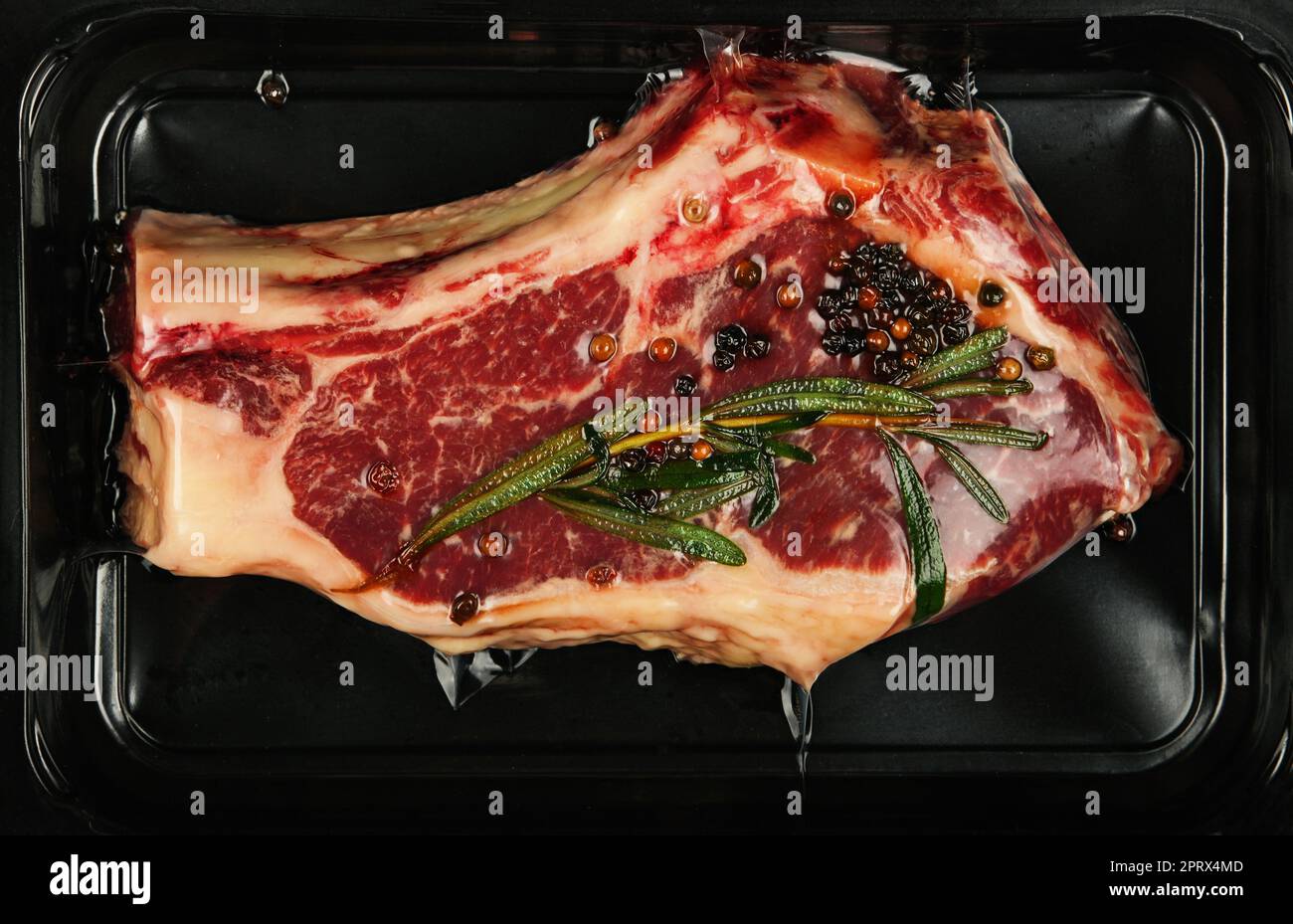 Close up raw beef ribeye steak vacuum sealed Stock Photo - Alamy