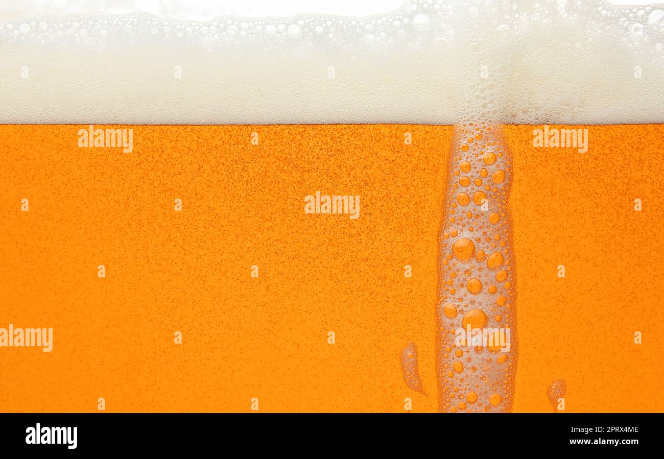 Close up background of beer with bubbles in glass Stock Photo - Alamy