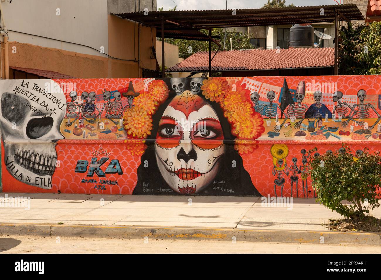 A painted wall mural celebrating Day of the Dead on a street in Villa ...
