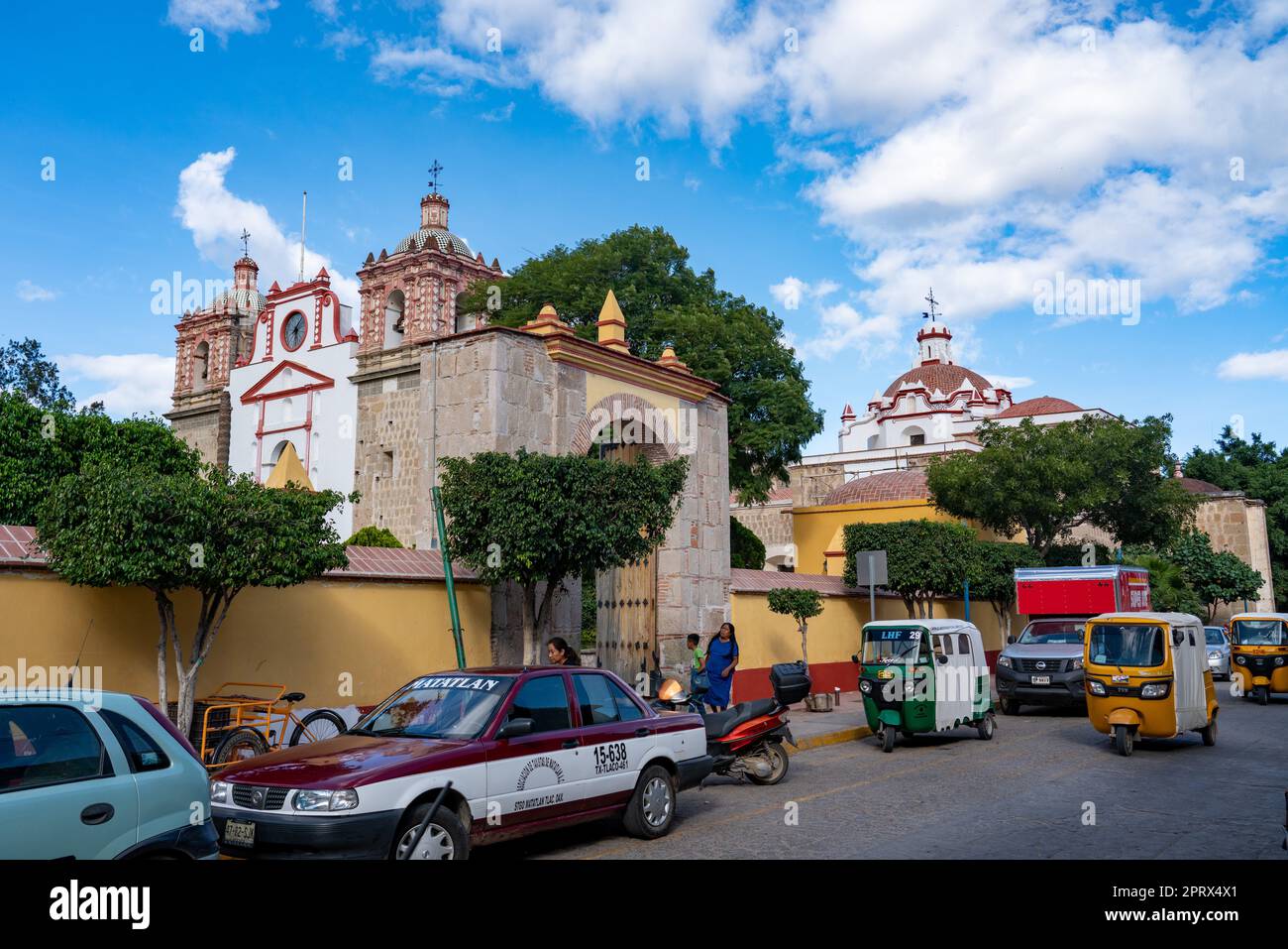 Traffic on the street beside the 16th century Church of Our Lady of the ...