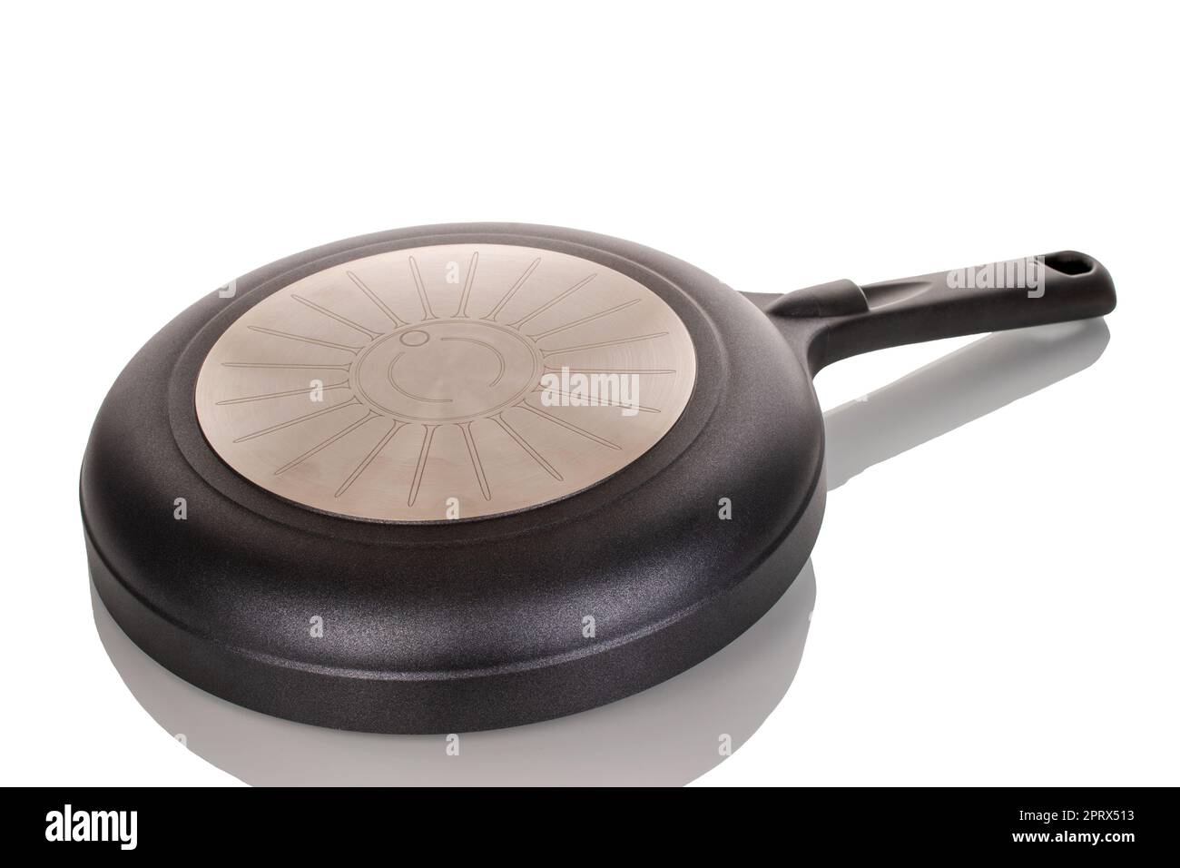 One metal frying pan, macro, isolated on white background Stock Photo ...