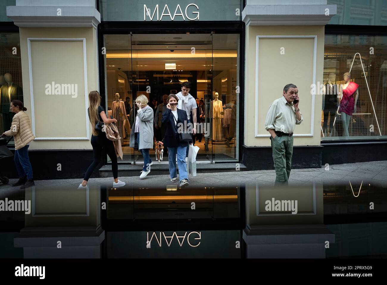People exit a newly opened Maag store, a former Zara flagship store, in ...