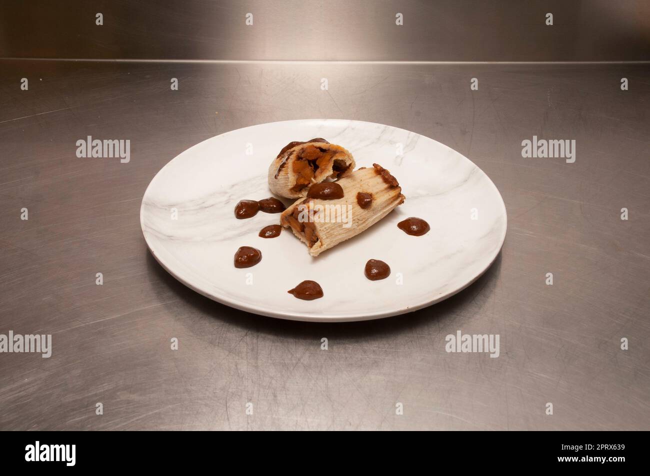 Mexican cuisine known as sweet potato and mole tamales Stock Photo - Alamy