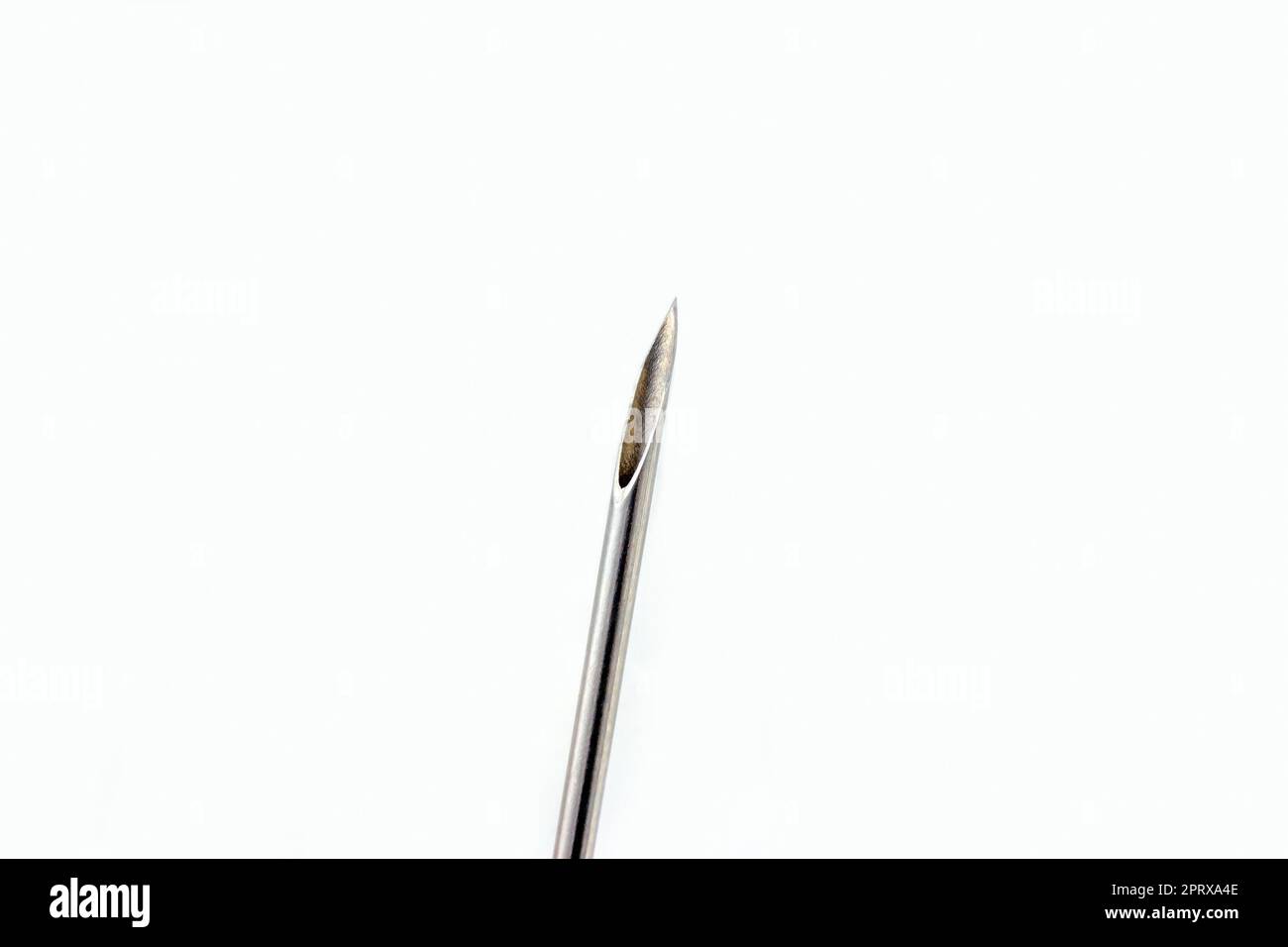 Steel medical cannula needle for injections on white background with ...