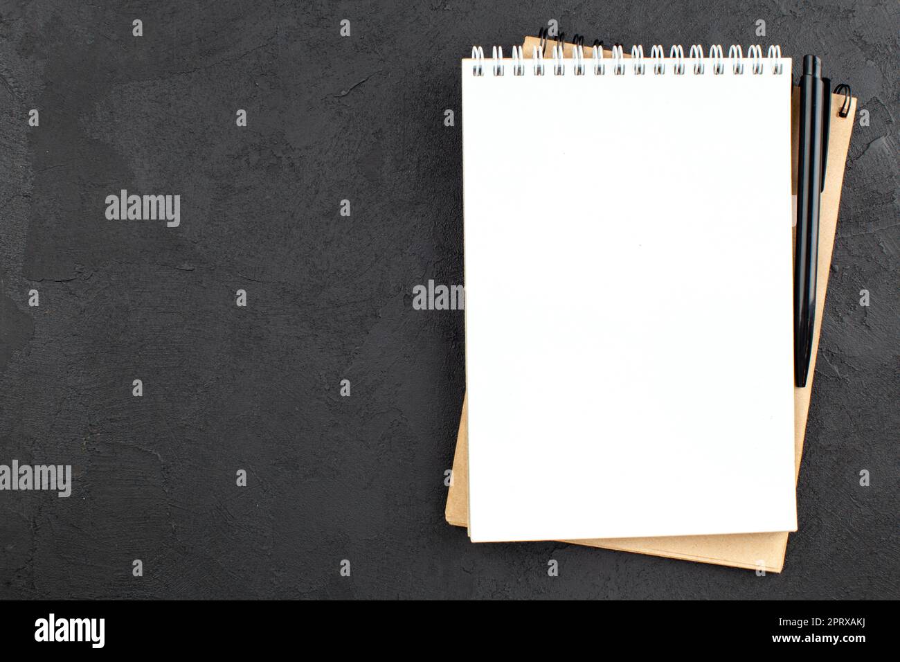 top view spiral notepad black pen on black table copy place Stock Photo ...
