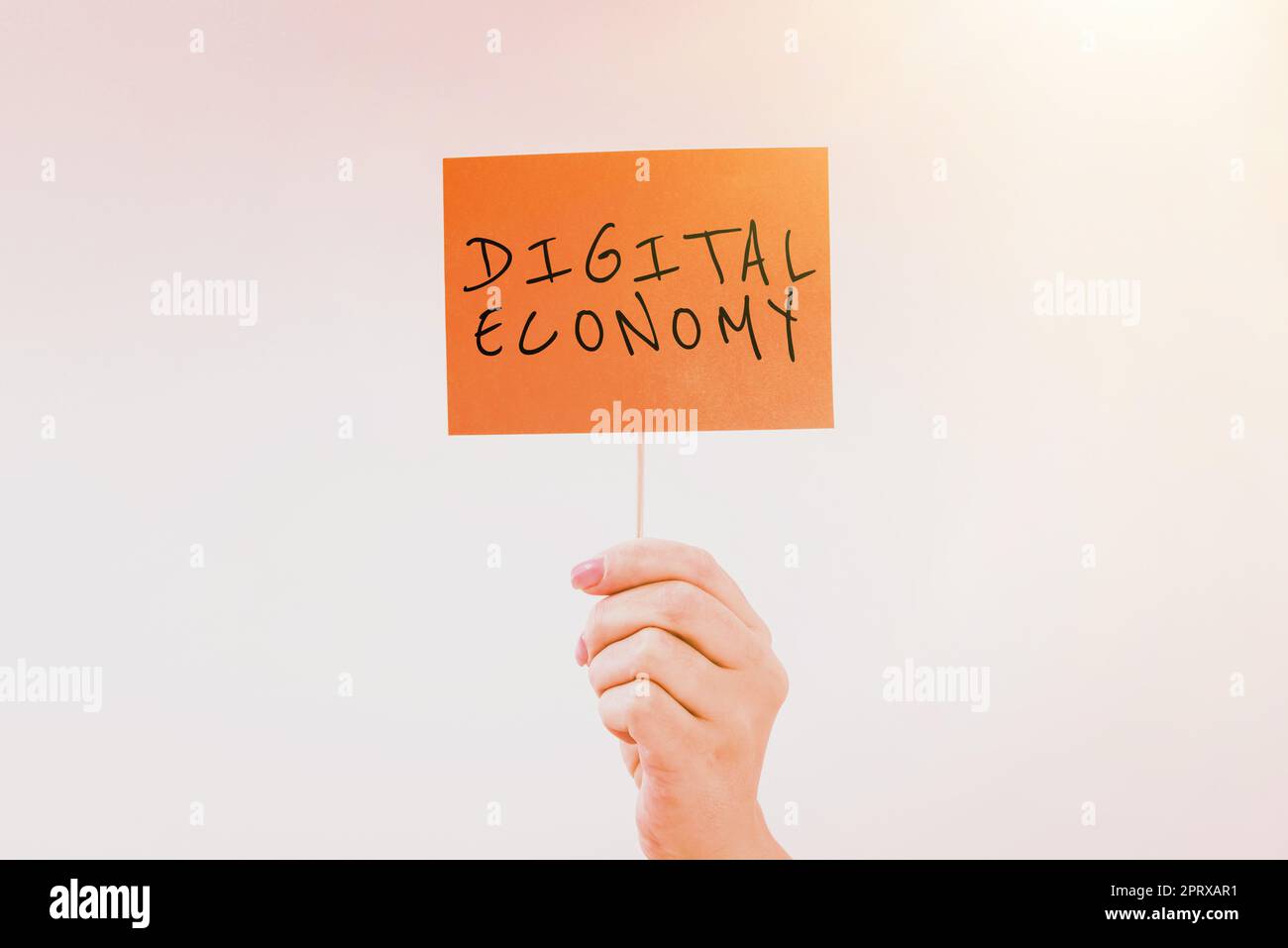 Hand writing sign Digital Economy, Concept meaning advancement of ...