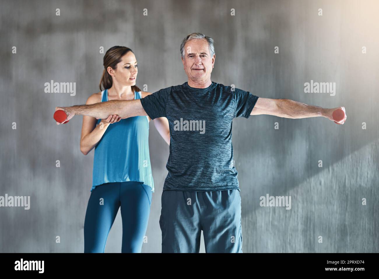 Counteracting muscle weakness with regular workouts. a senior man using ...