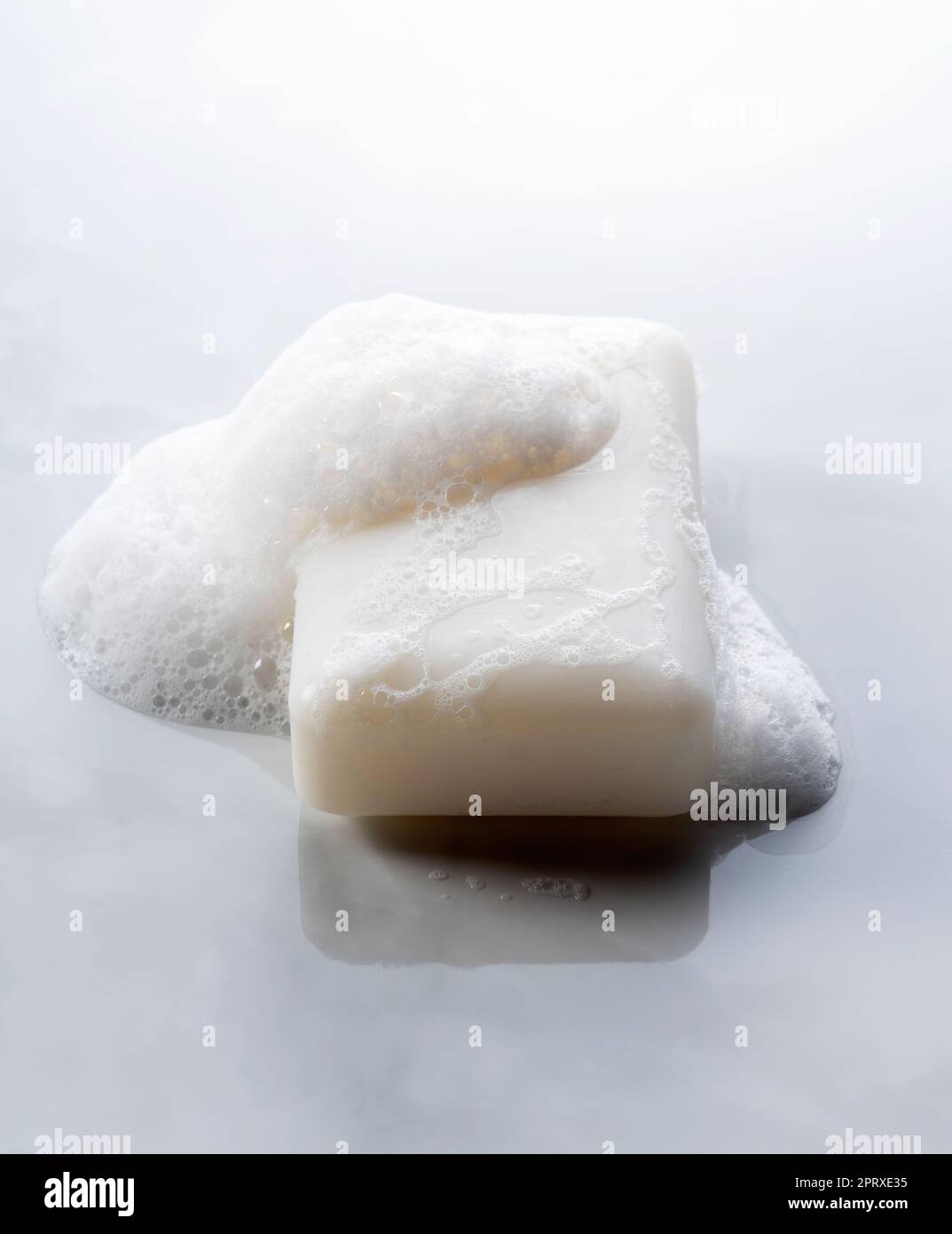 Solid soap with foam placed on marble background Stock Photo - Alamy
