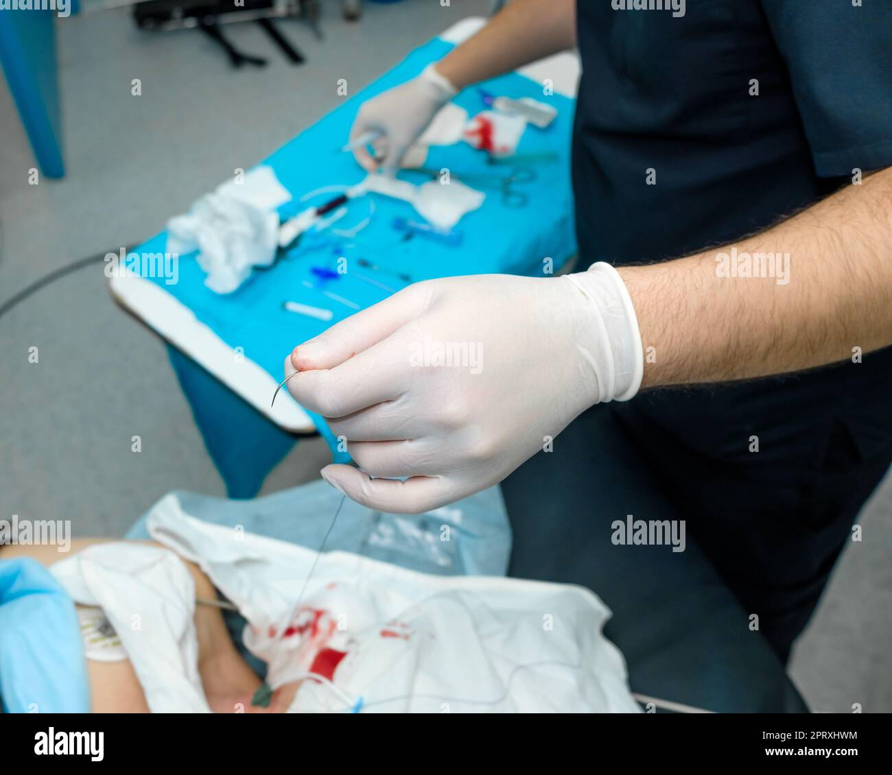 Doctor stitching patients hand hi-res stock photography and images - Alamy