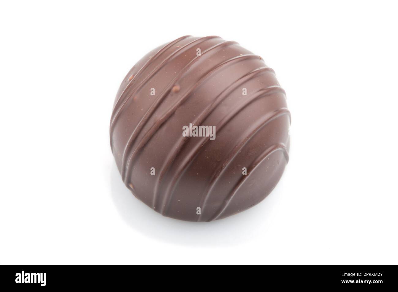 Single chocolate candy isolated on white background. side view, close ...