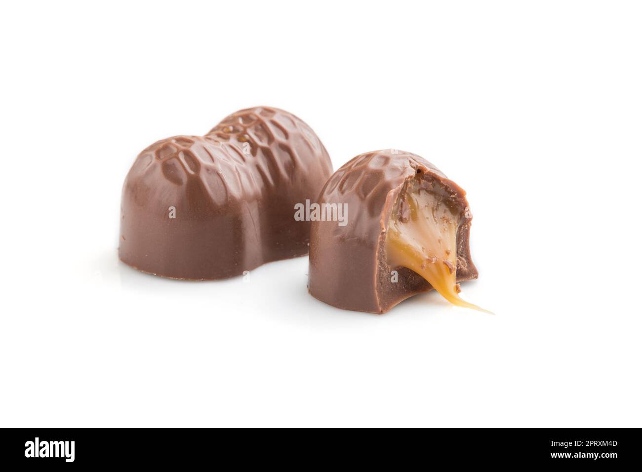 Chocolate caramel candies isolated on white background. Side view ...