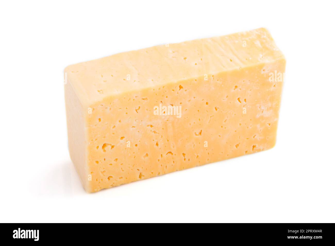 Piece of yellow cheese isolated on white background. Side view, close ...