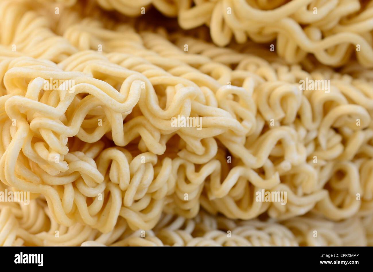 Close up view of yellow dry instant noodles. Chinese traditional food ...