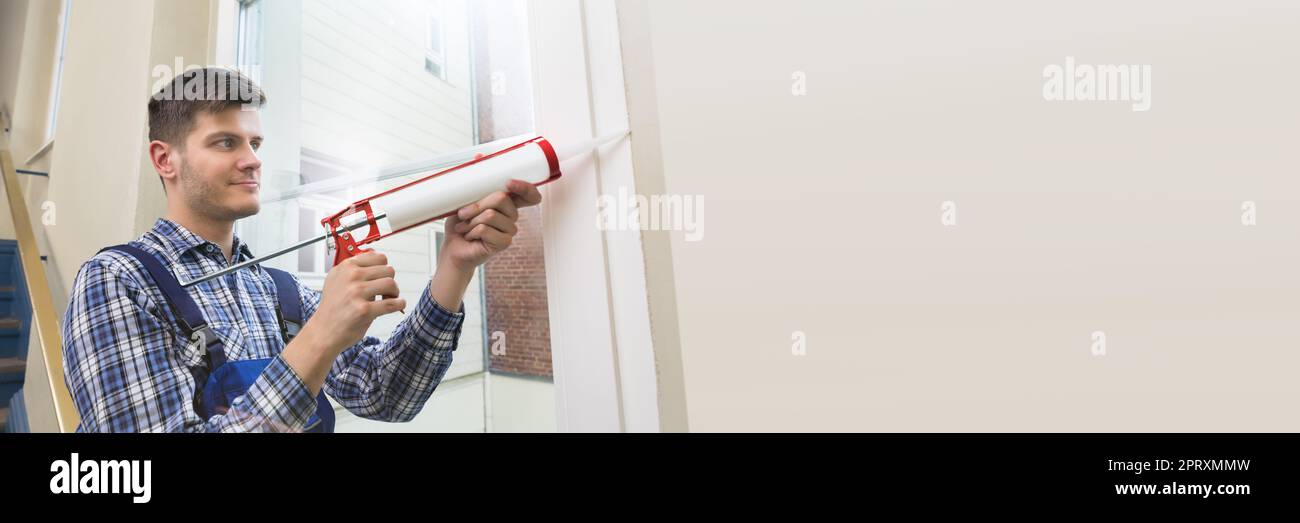 Caulking Silicone Sealant To Repair Window In House Stock Photo - Alamy