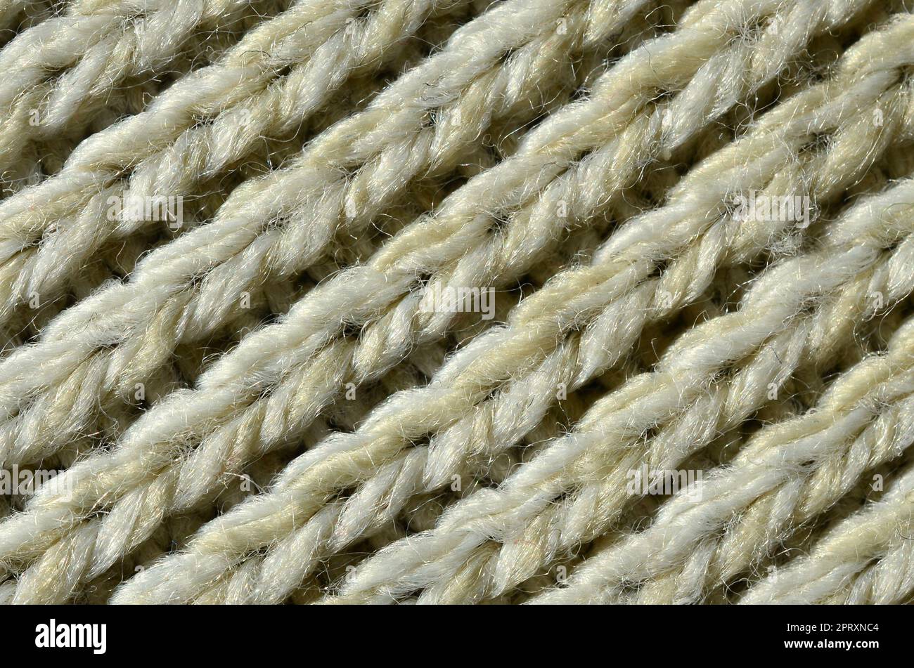 Fabric texture of a soft yellow knitted sweater. Macro image of the ...