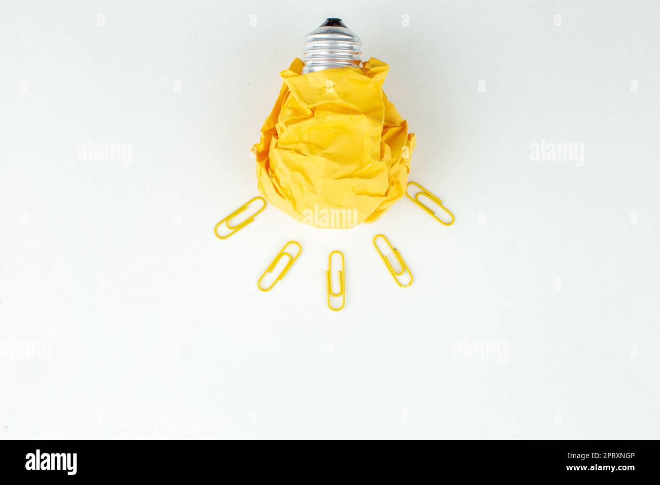 top view yellow idealight bulb gem clips on white background Stock ...