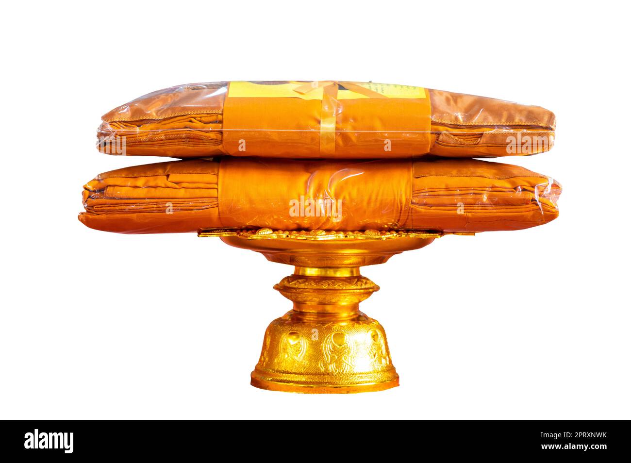 set of monk's robes placed on a pedestal on a white background isolate ...