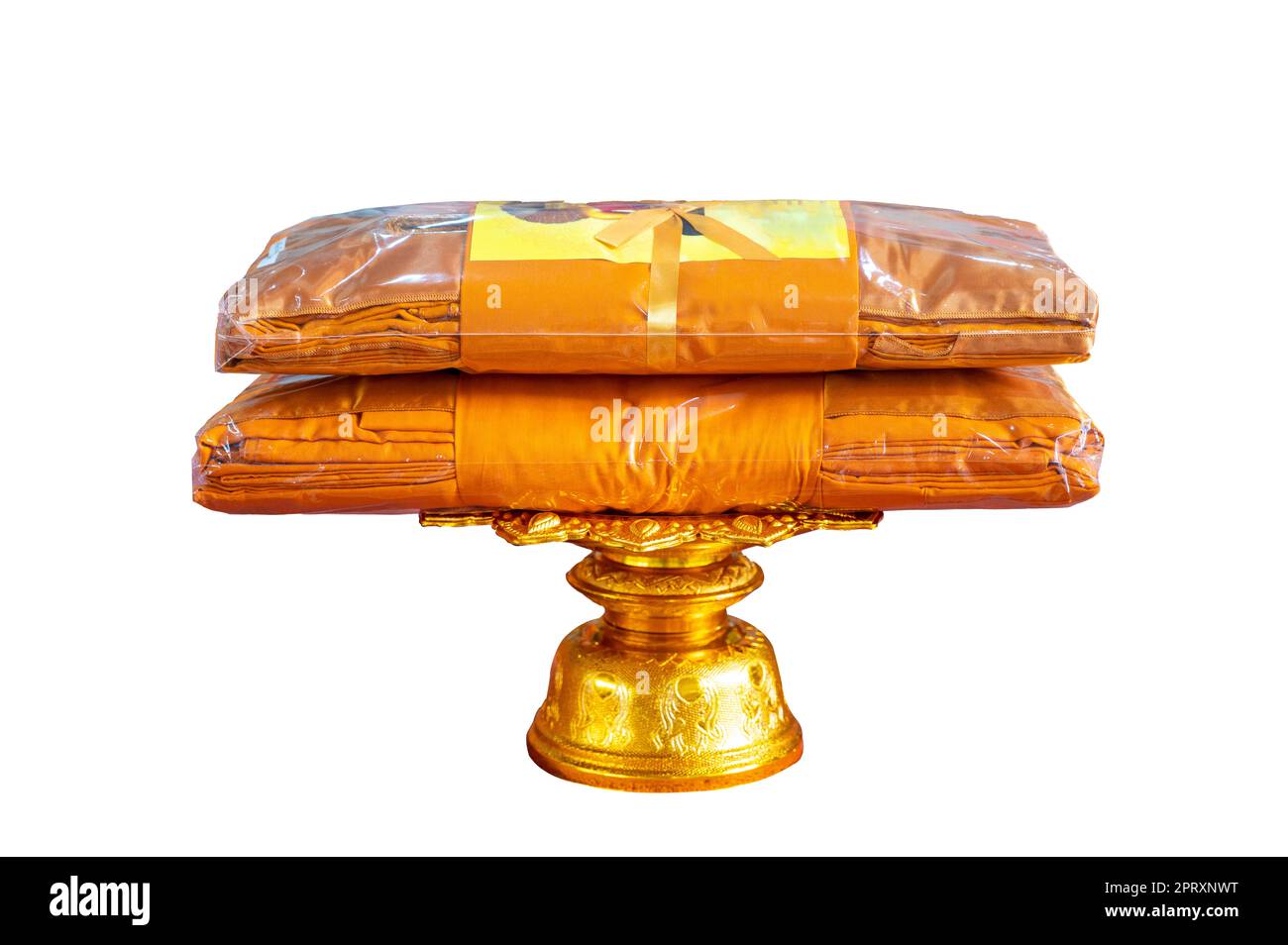 set of monk's robes placed on a pedestal on a white background isolate ...