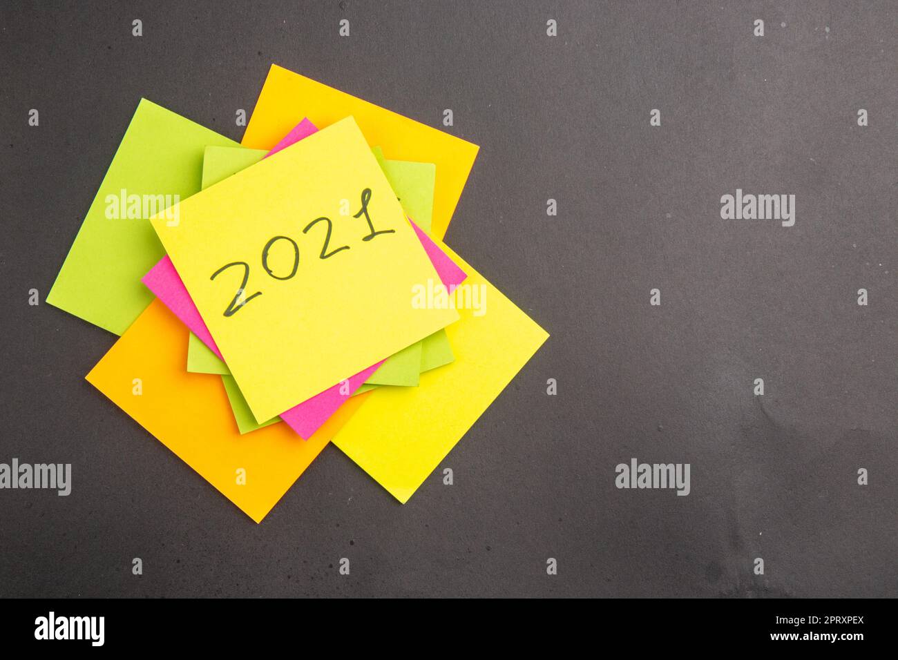 top view written on sticky note colorful sticky notes on dark ...