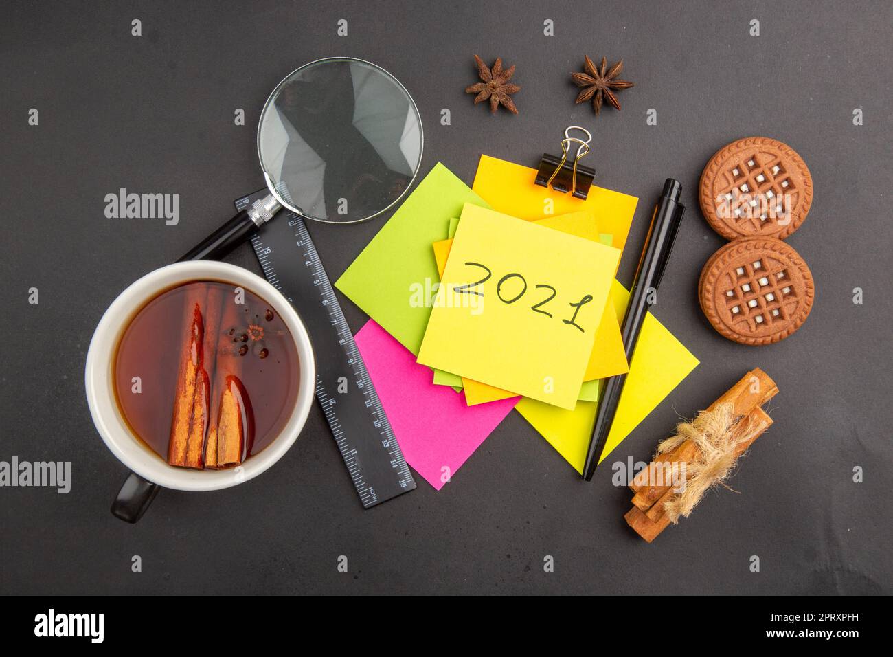 top view written on sticky note colorful sticky notes lupa pen cinnamon ...