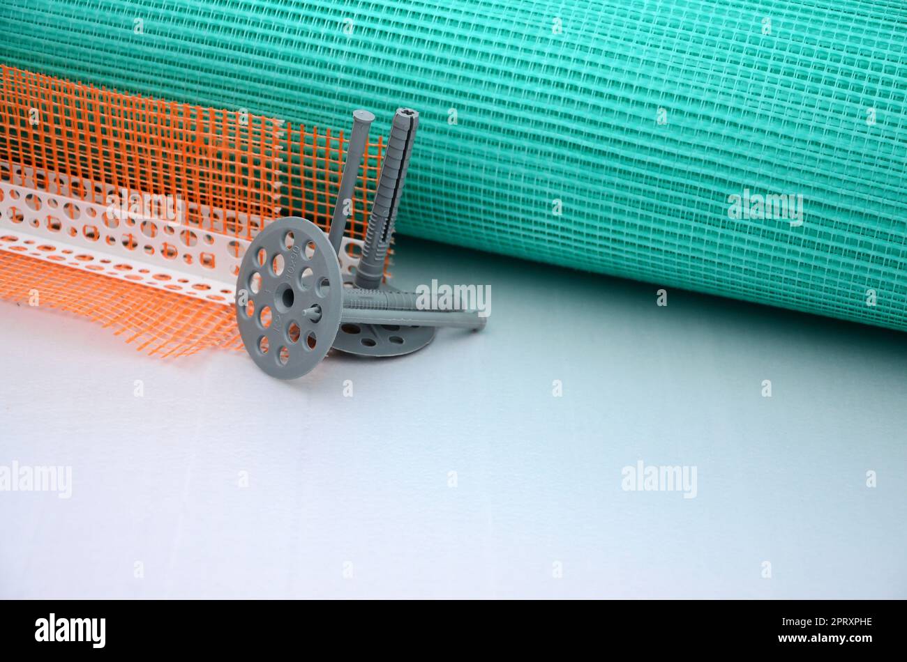 A set of construction items for the insulation of walls. Plastic dowels ...