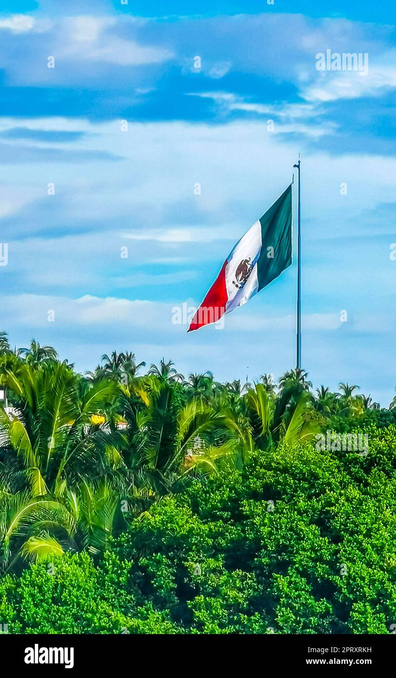 Mexican green white red flag with palm trees and blue sky and clouds in ...