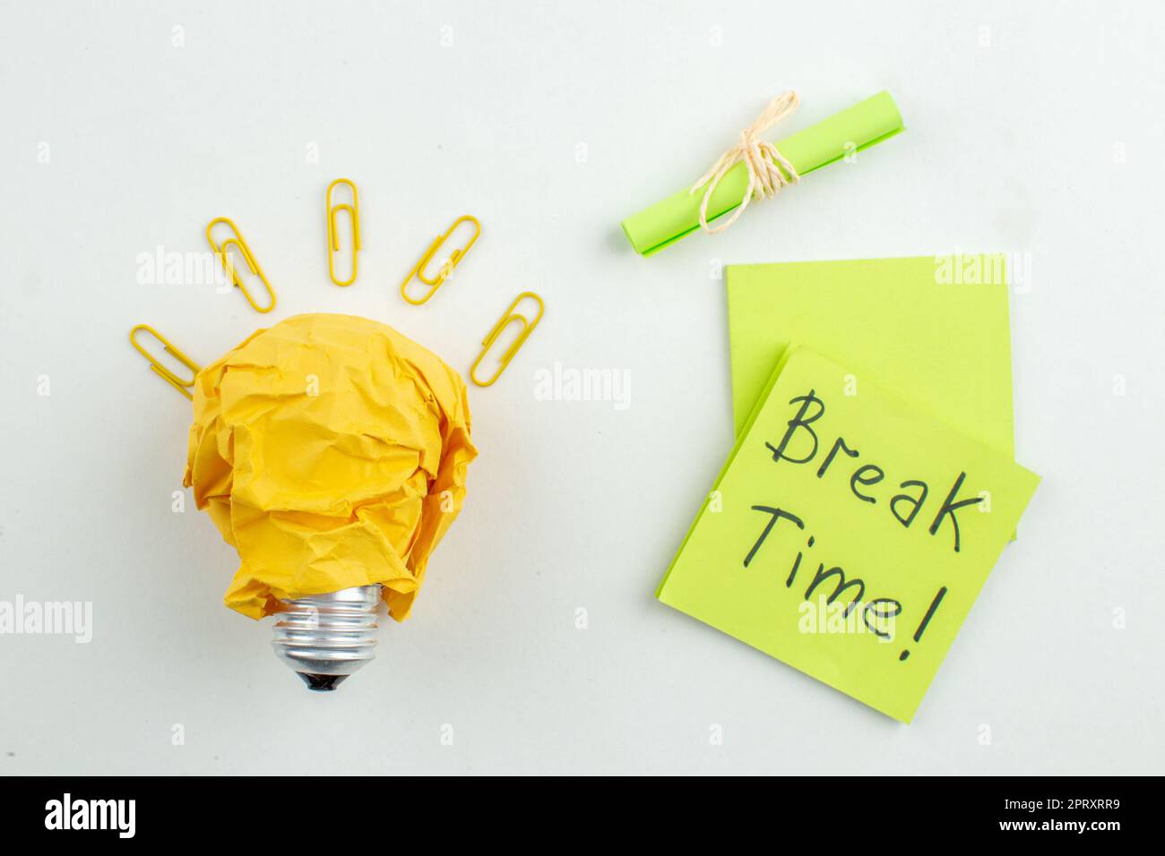 top view break time written on sticky note idealight bulb gem clips on ...