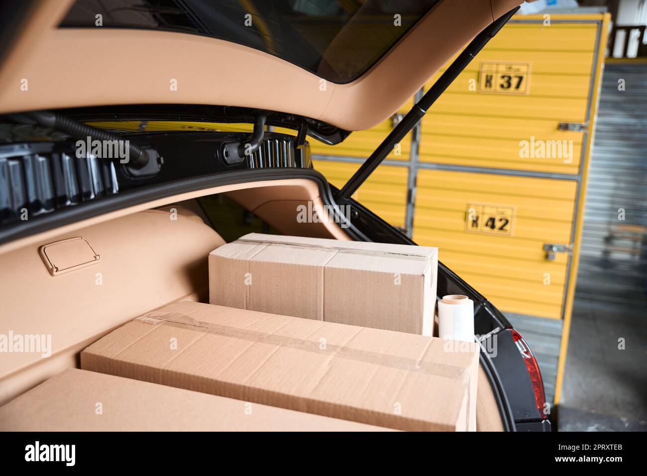Cardboard boxes lying in the automobile trunk in the warehouse Stock ...